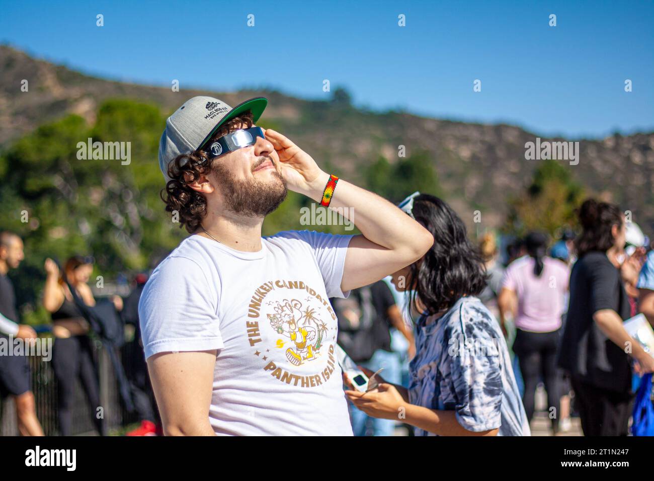 A young man watching the solar eclipse at Griffith Observatory Stock ...
