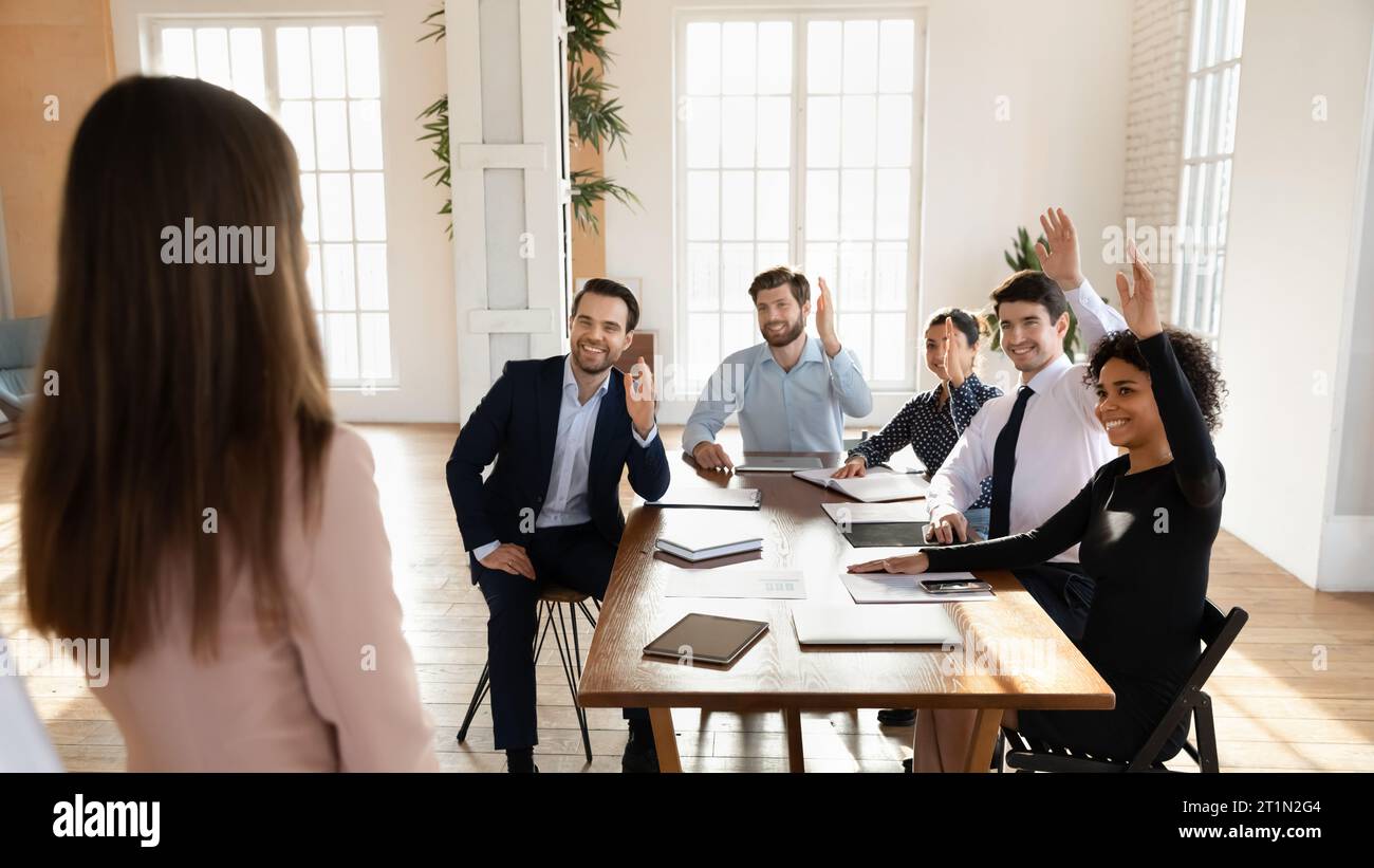 Happy diverse business team voting on presentation, raising hands Stock ...