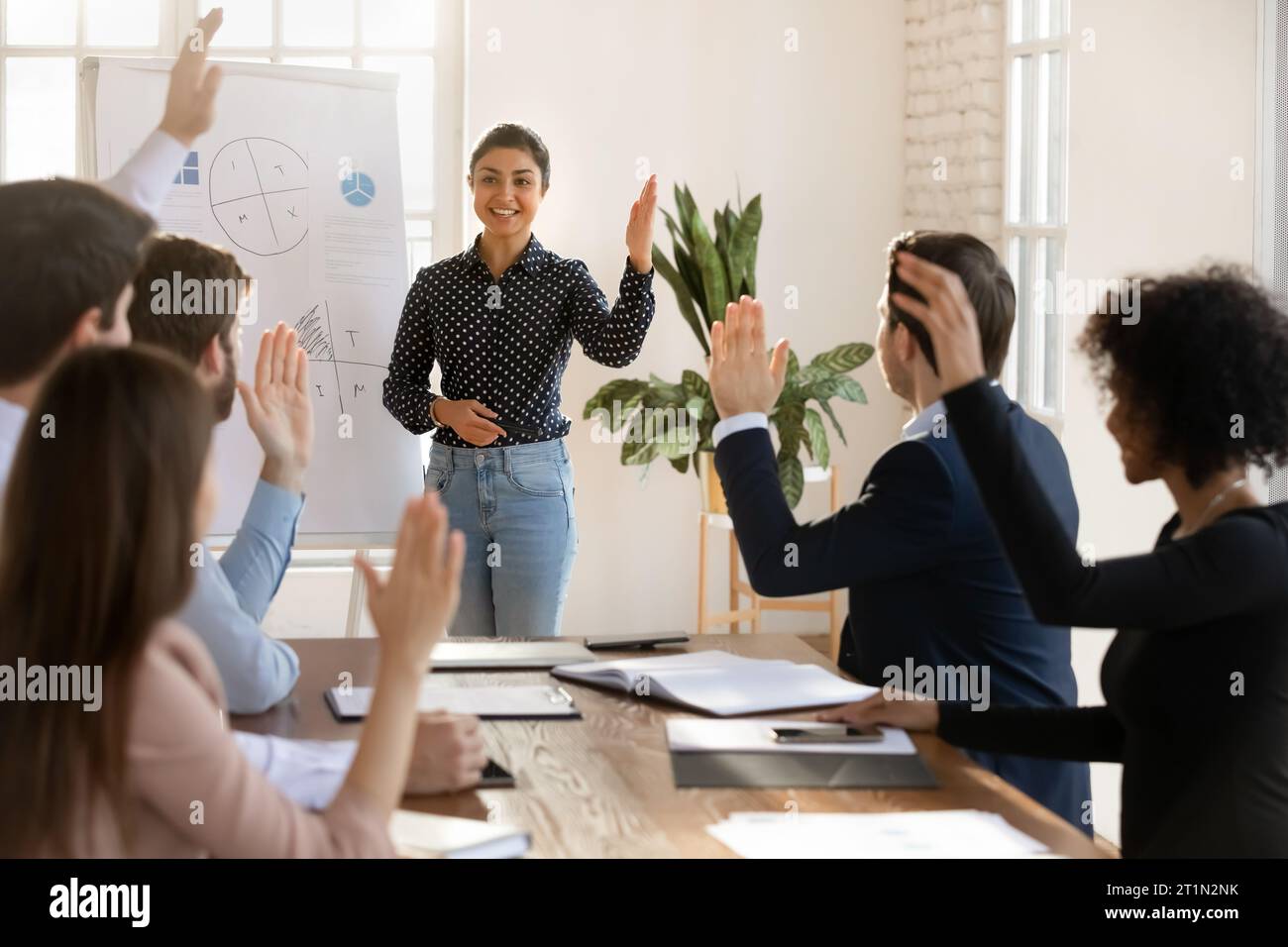 Diverse business team and presenter voting for new project plan Stock ...