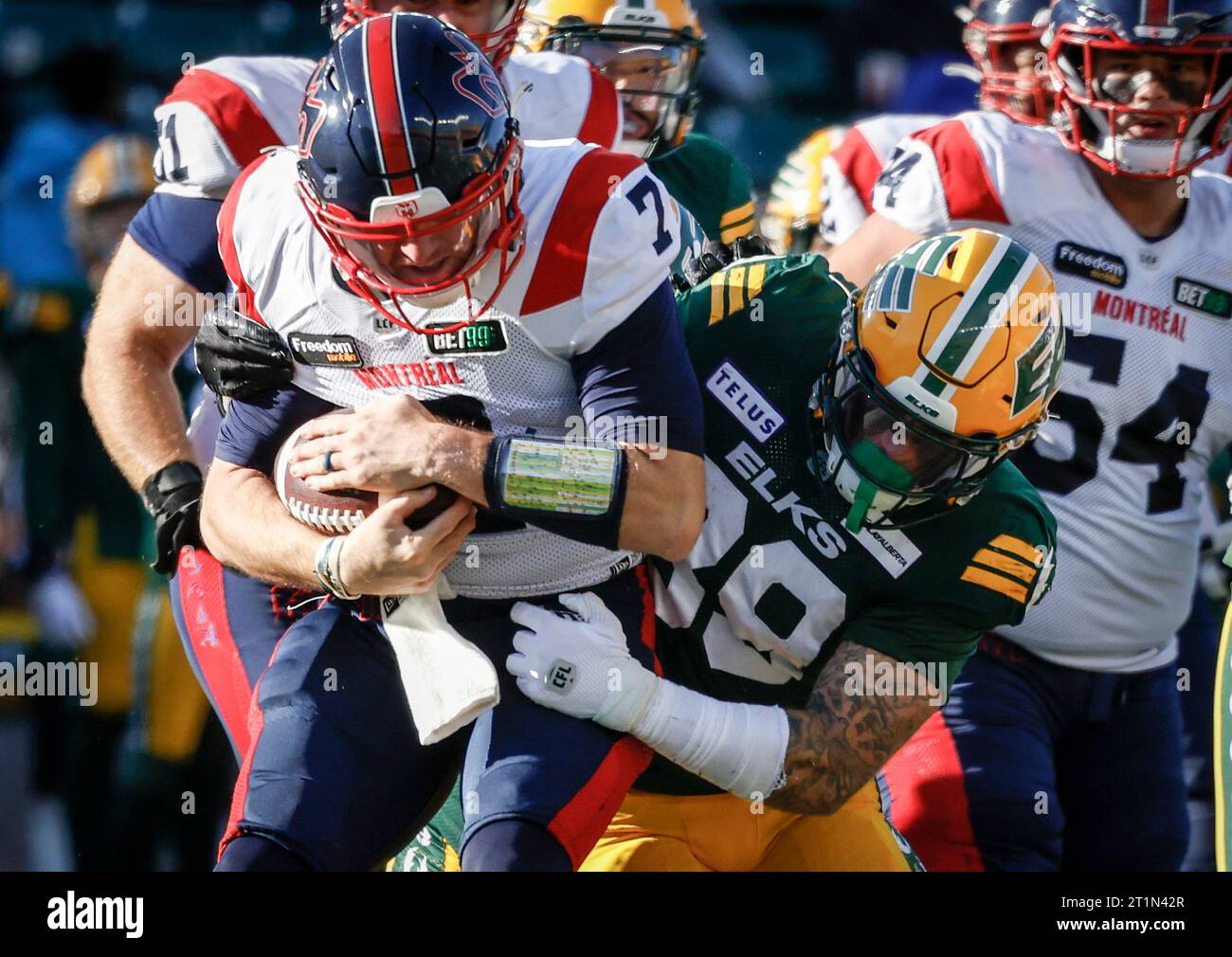 Montreal Alouettes quarterback Cody Fajardo, left, is sacked by ...