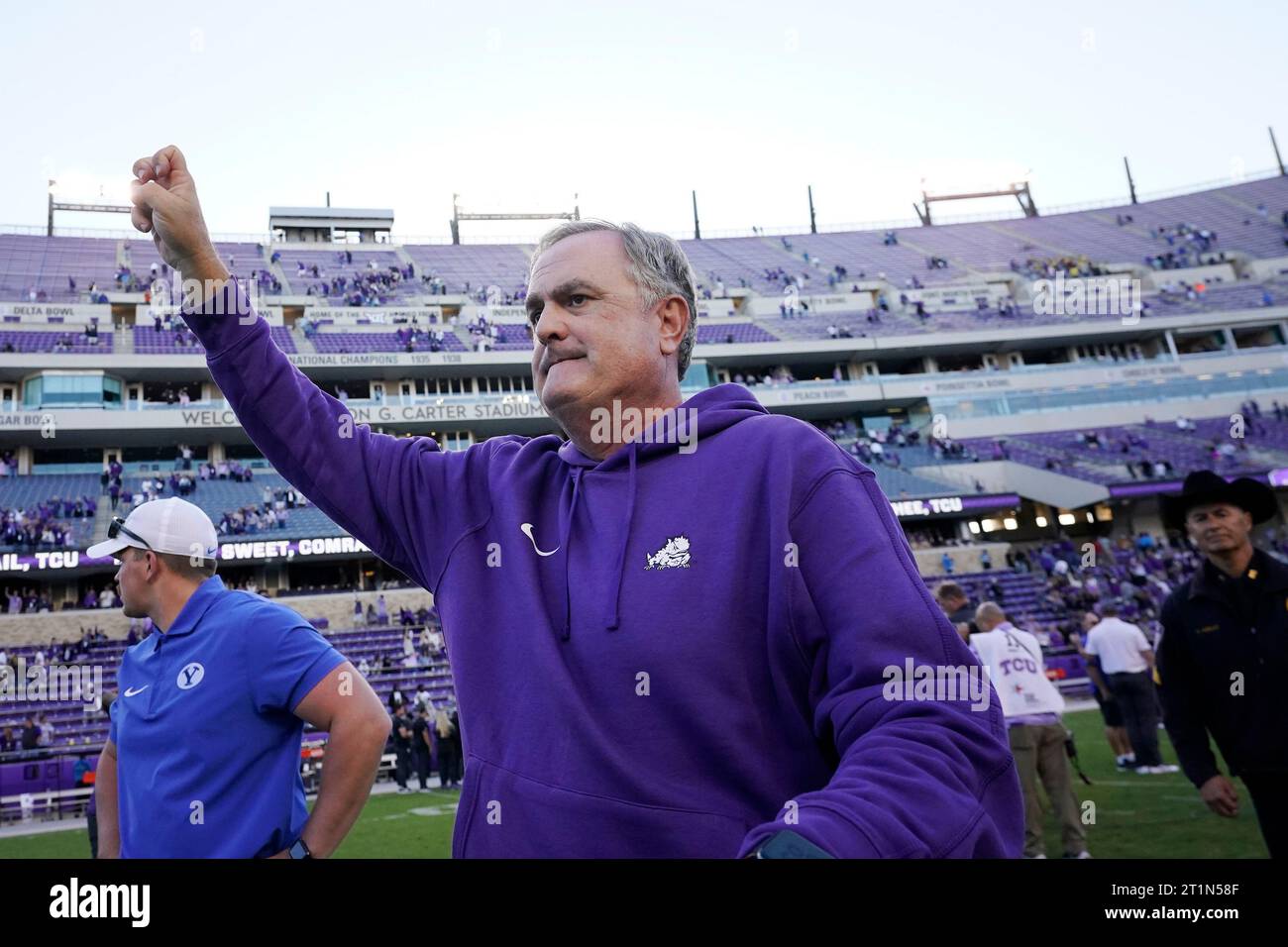 TCU head coach Sonny Dykes gestures as he hears the school song after ...