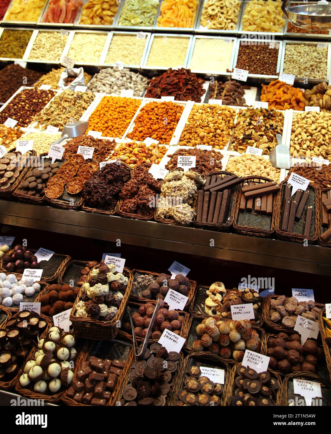 A market stall selling numerous types of chocolate treats and dried ...