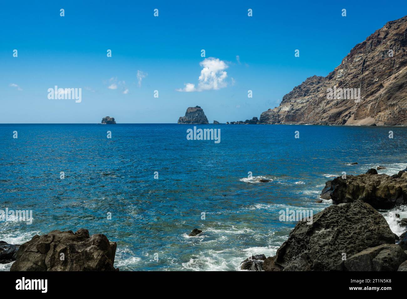 Lava cliff and sea stacks (Roques de Salmor) at eastern end of the El Golfo embayment, Las ...