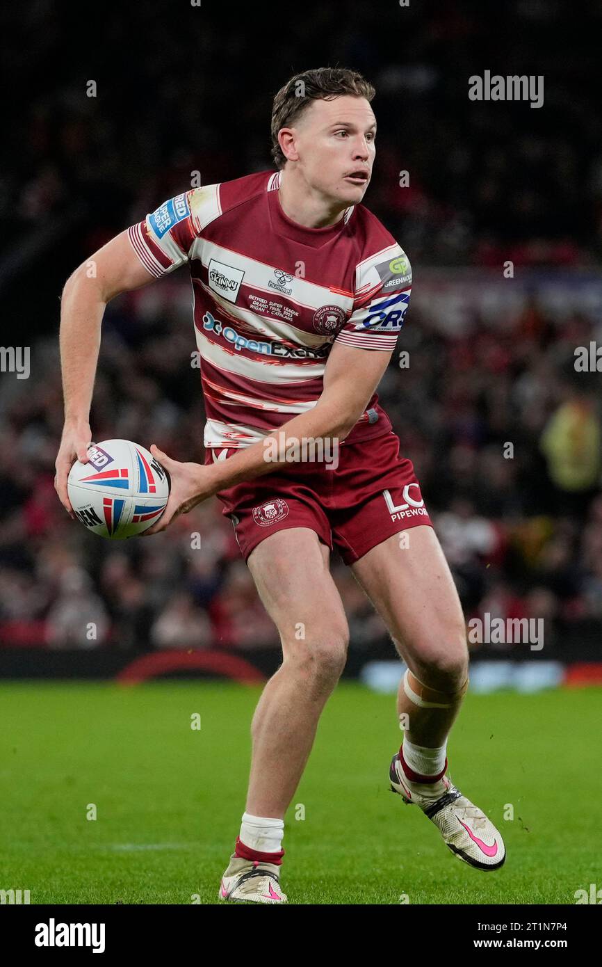 Jai Field #1 of Wigan Warriors runs with the ball during the Betfred ...