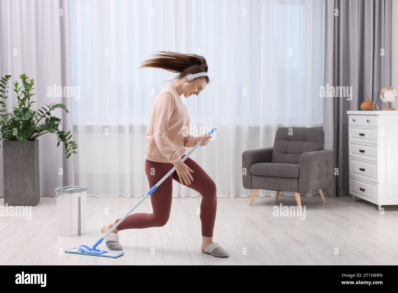 Dancing cleaning house hi-res stock photography and images - Alamy
