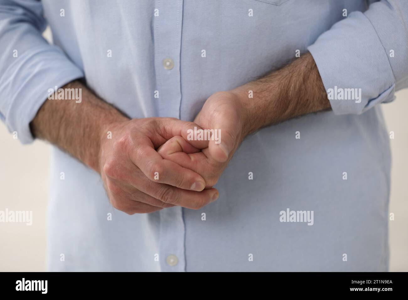 Man cracking his knuckles, closeup. Bad habit Stock Photo - Alamy