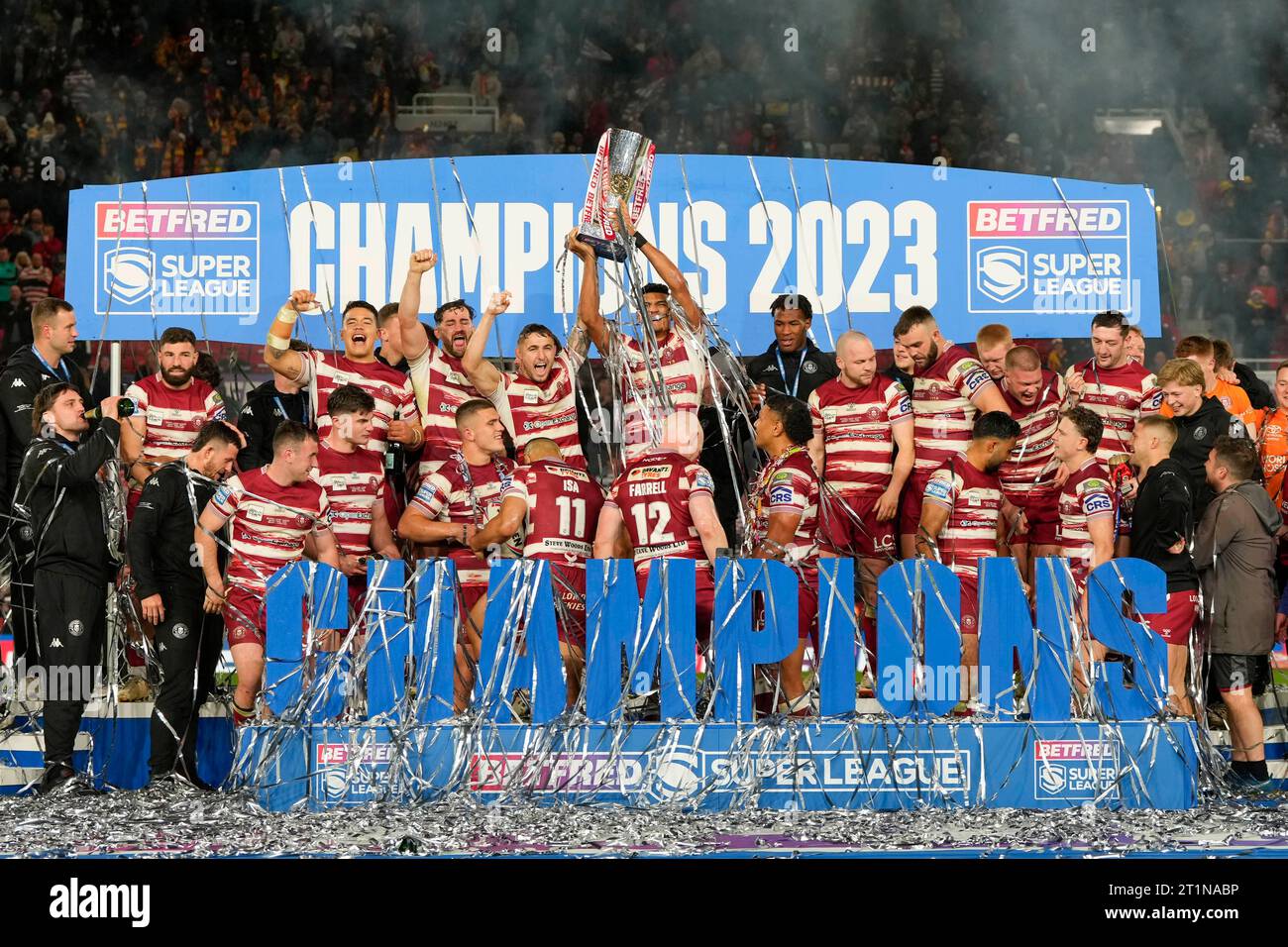 Kai Pearce-Paul #17 of Wigan Warriors lifts the Super League Trophy ...