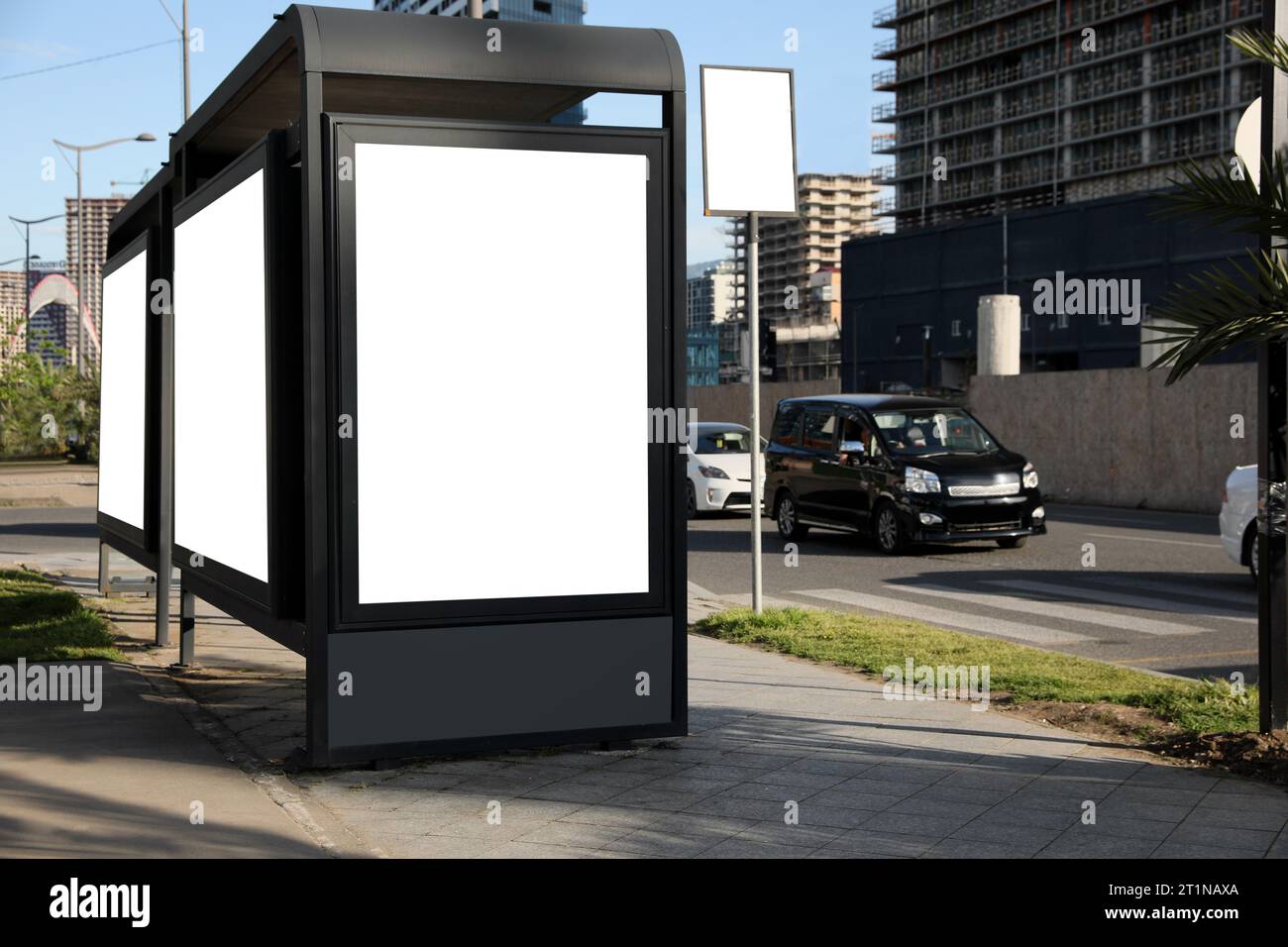 Bus stop with empty signboards in city. Mock-up for design Stock Photo ...