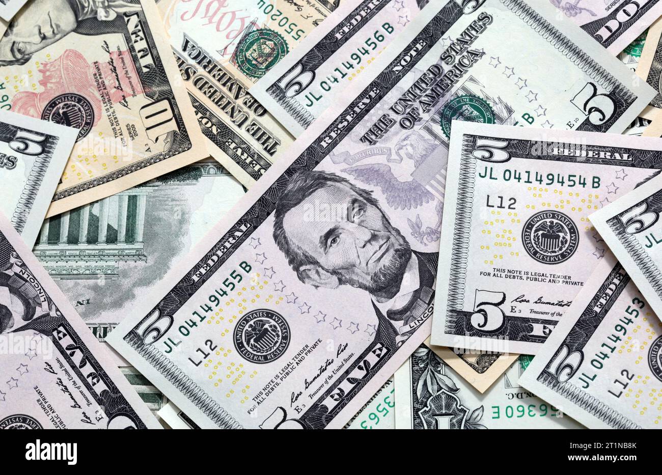 Various US dollar notes scattered. No complete notes shown and angled ...