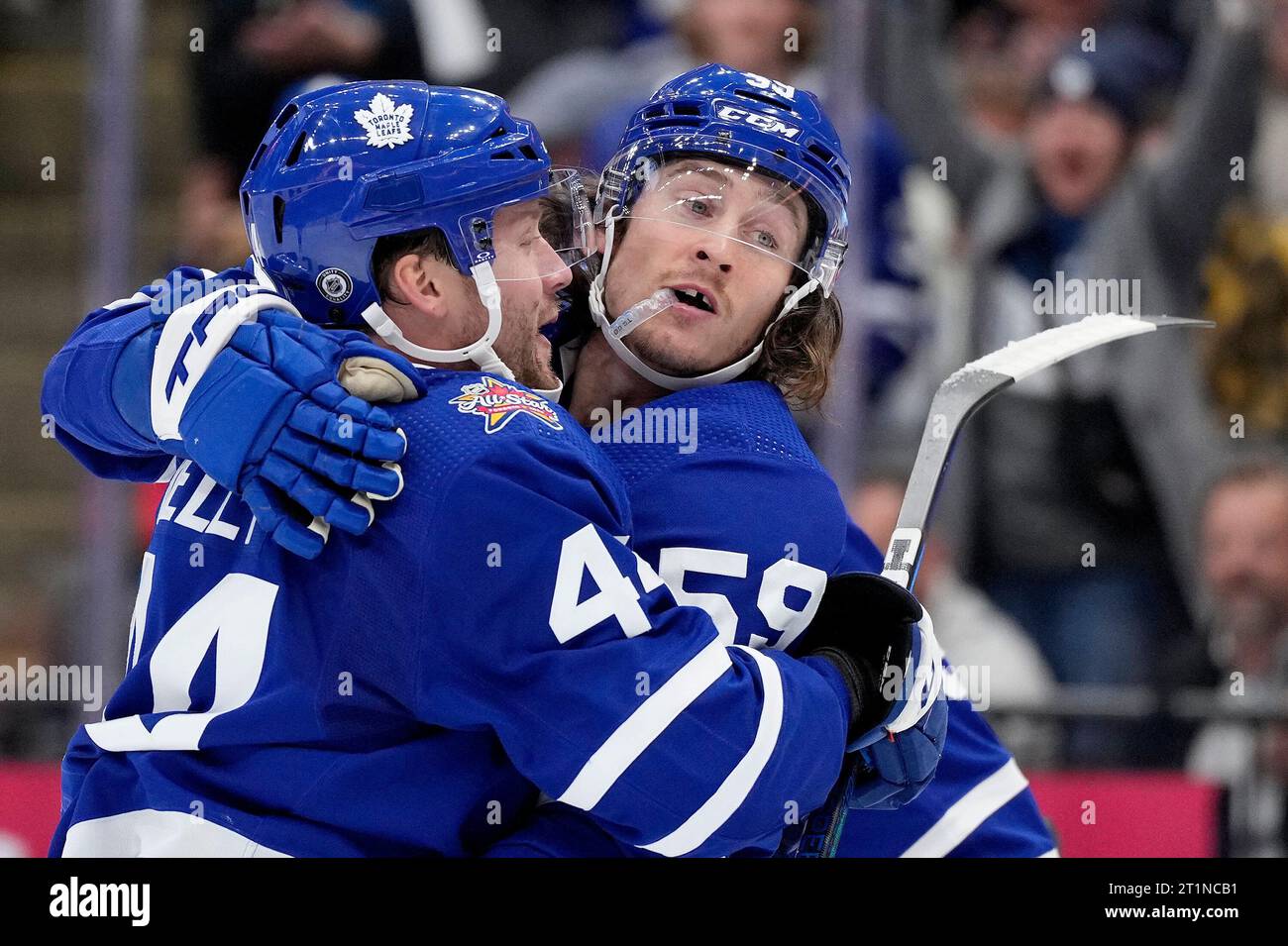 Toronto Maple Leafs left wing Tyler Bertuzzi (59) embraces teammate ...