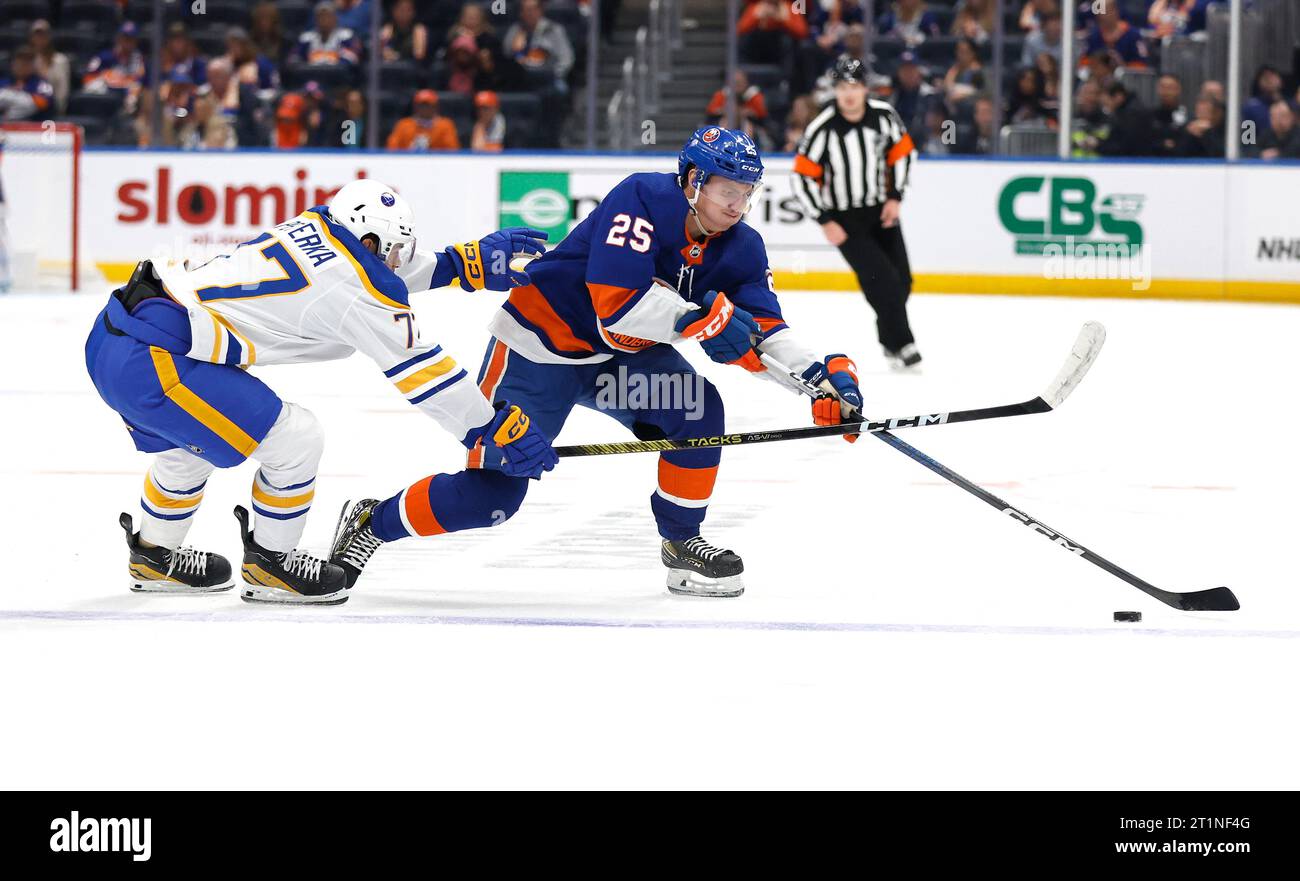 New York Islanders defenseman Sebastian Aho (25) plays the puck against ...
