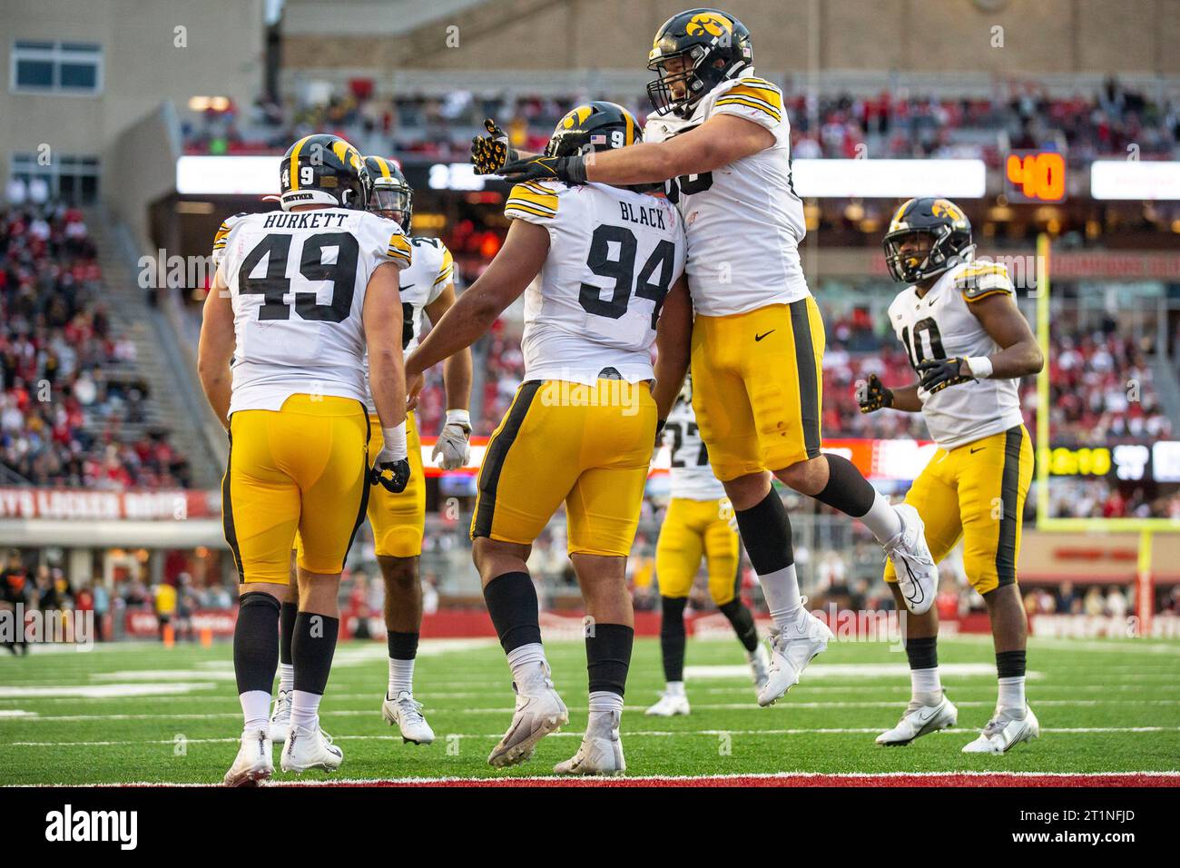 Iowa defensive lineman Yahya Black (94) is swarmed by teammates after ...