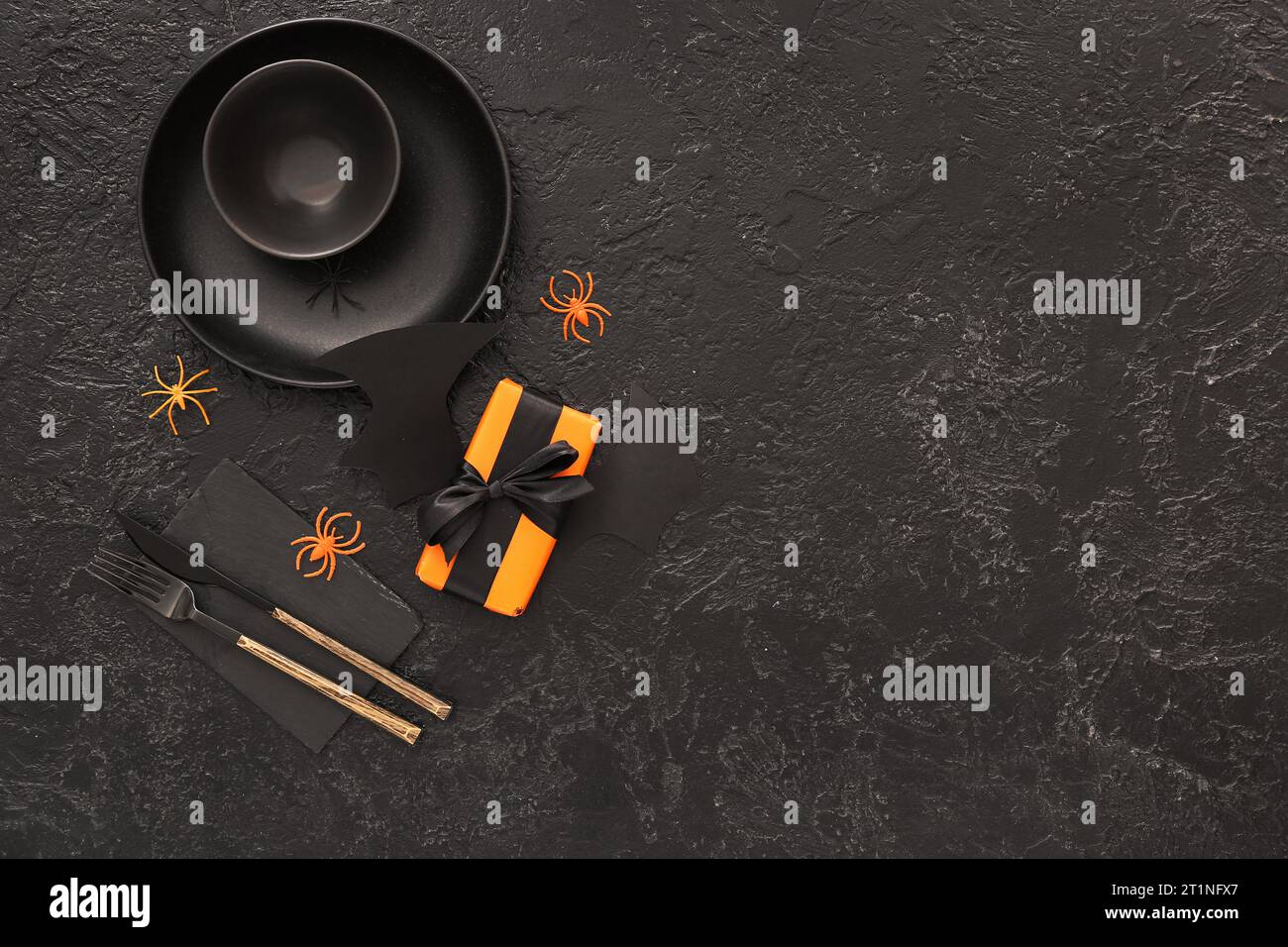 Halloween table setting on dark background Stock Photo - Alamy
