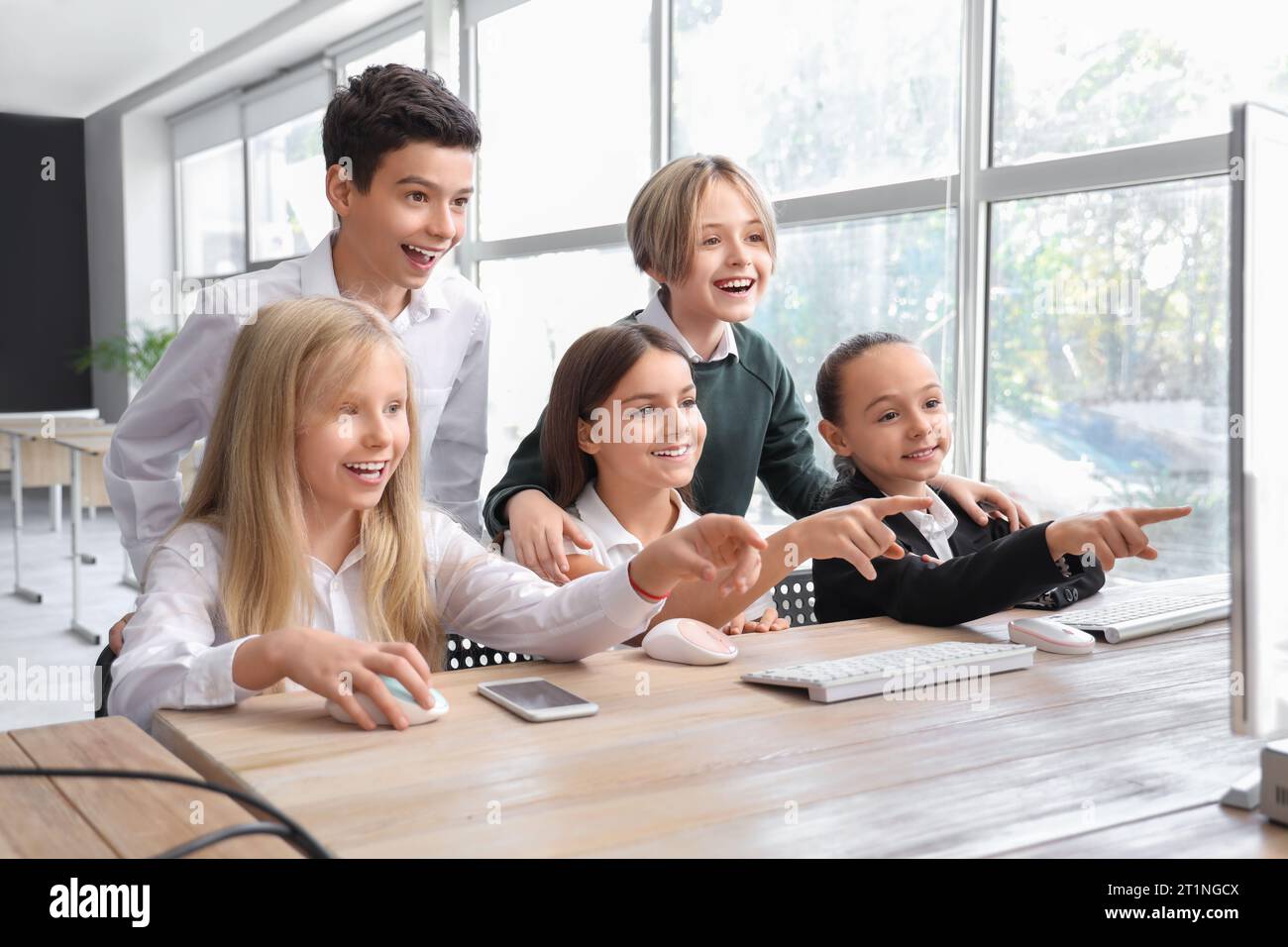 Little children studying at school computer lab Stock Photo - Alamy