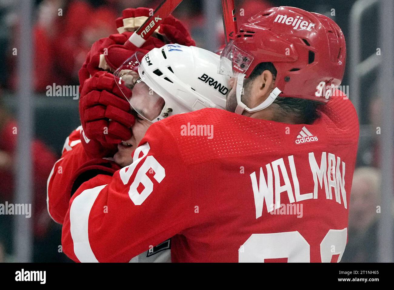 Detroit Red Wings defenseman Jake Walman (96) holds Tampa Bay Lightning ...