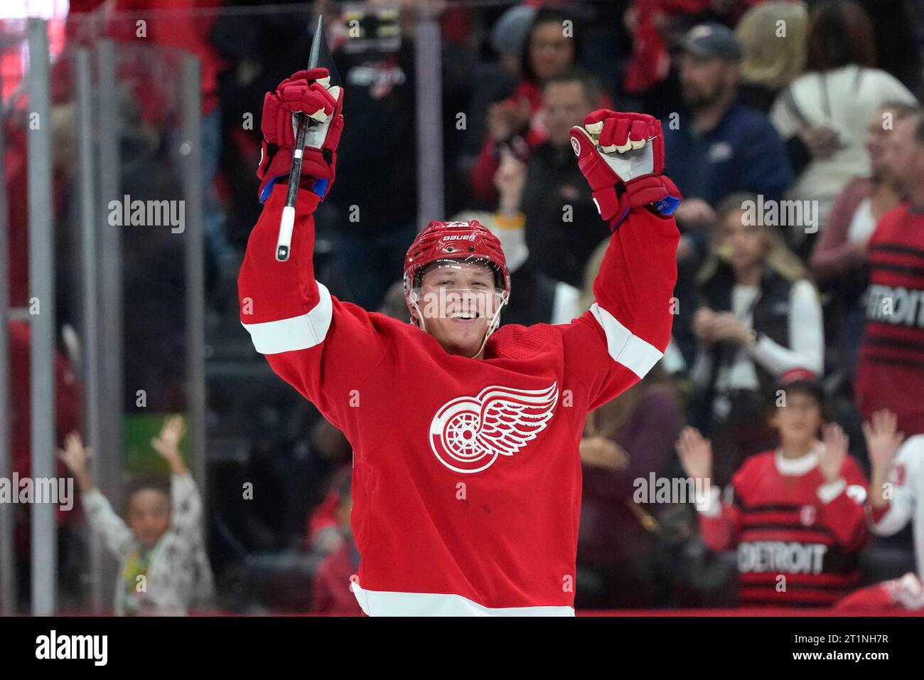 Detroit Red Wings left wing Lucas Raymond raises his arms after the ...