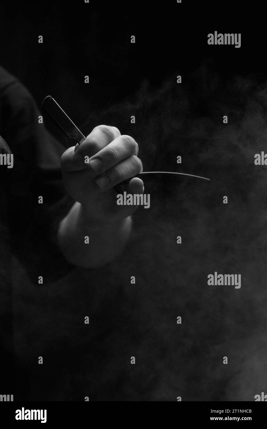 Barber holding razor blade. Barber skills. Shaving Stock Photo - Alamy