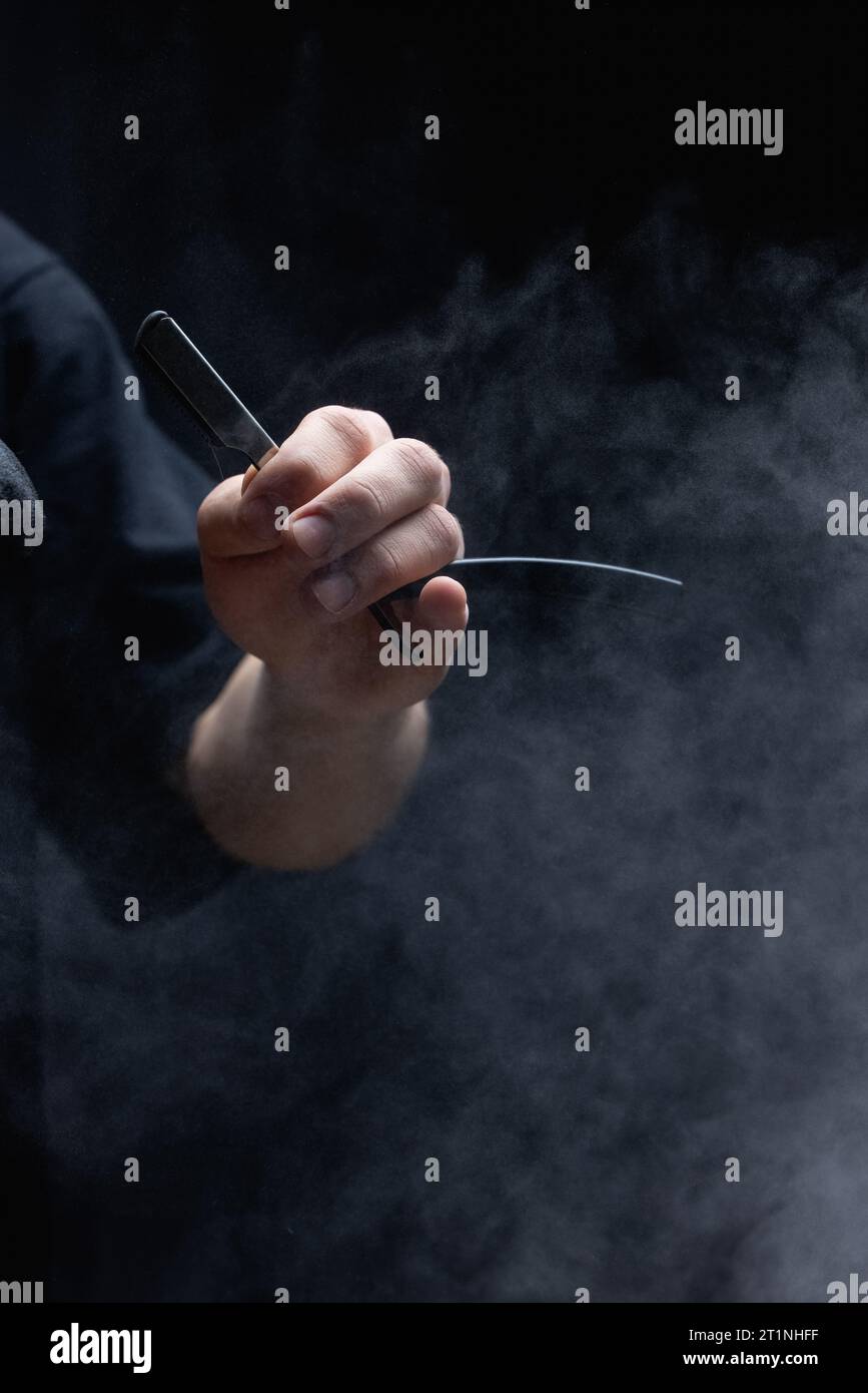 Barber holding razor blade. Barber skills. Shaving Stock Photo - Alamy