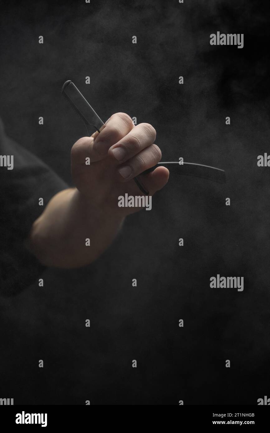 Barber holding razor blade. Barber skills. Shaving Stock Photo - Alamy