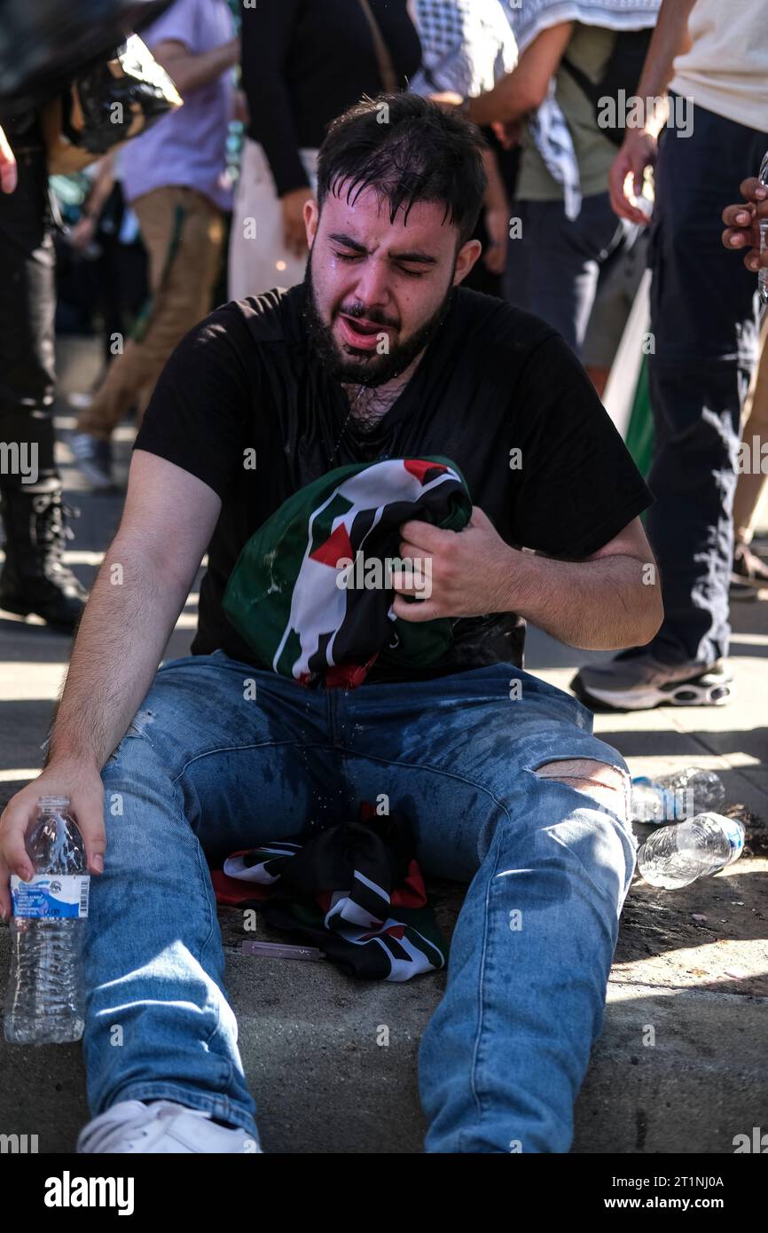 Los Angeles, California, USA. 14th Oct, 2023. A demonstrator winces in ...