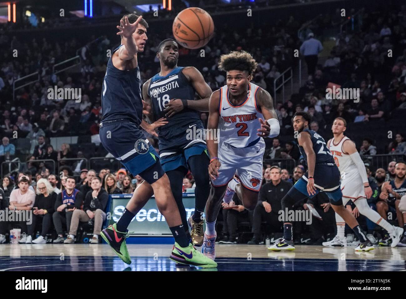 New York Knicks' Miles McBride (2) passes ball around Minnesota ...