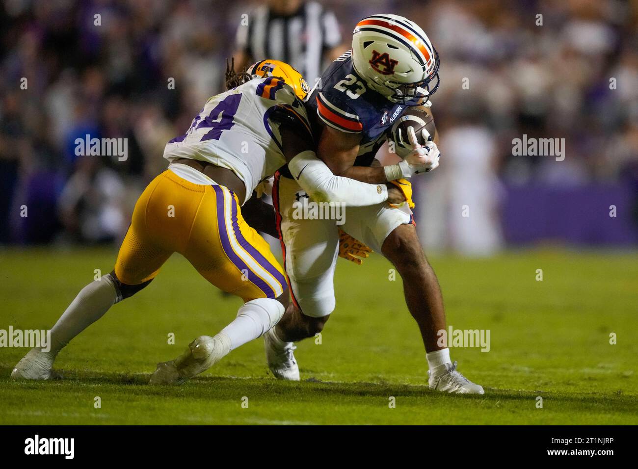 Auburn running back Jeremiah Cobb (23) carries against LSU safety Andre ...