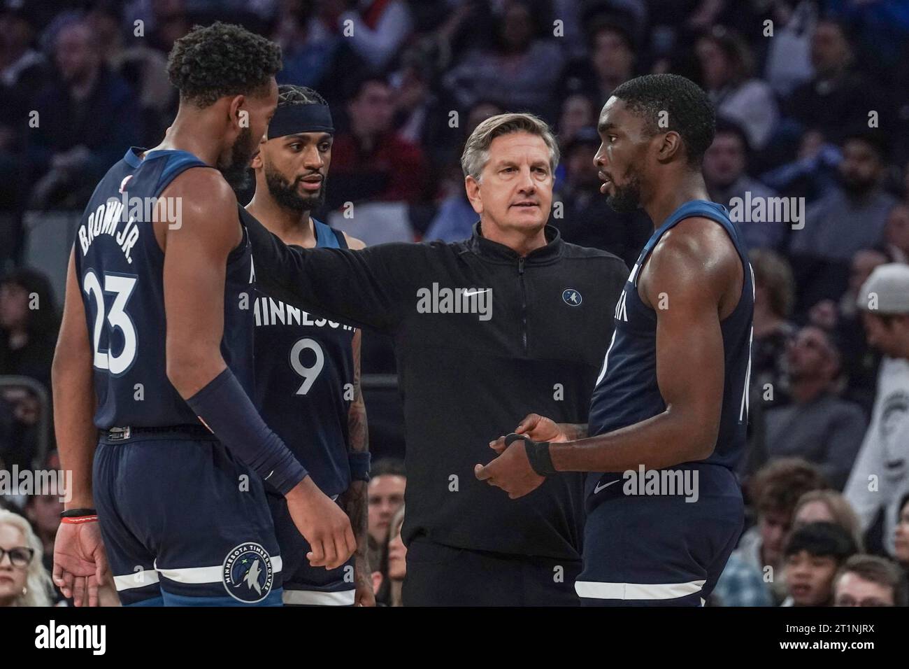 Minnesota Timberwolves coach Chris Finch huddle with players during a ...