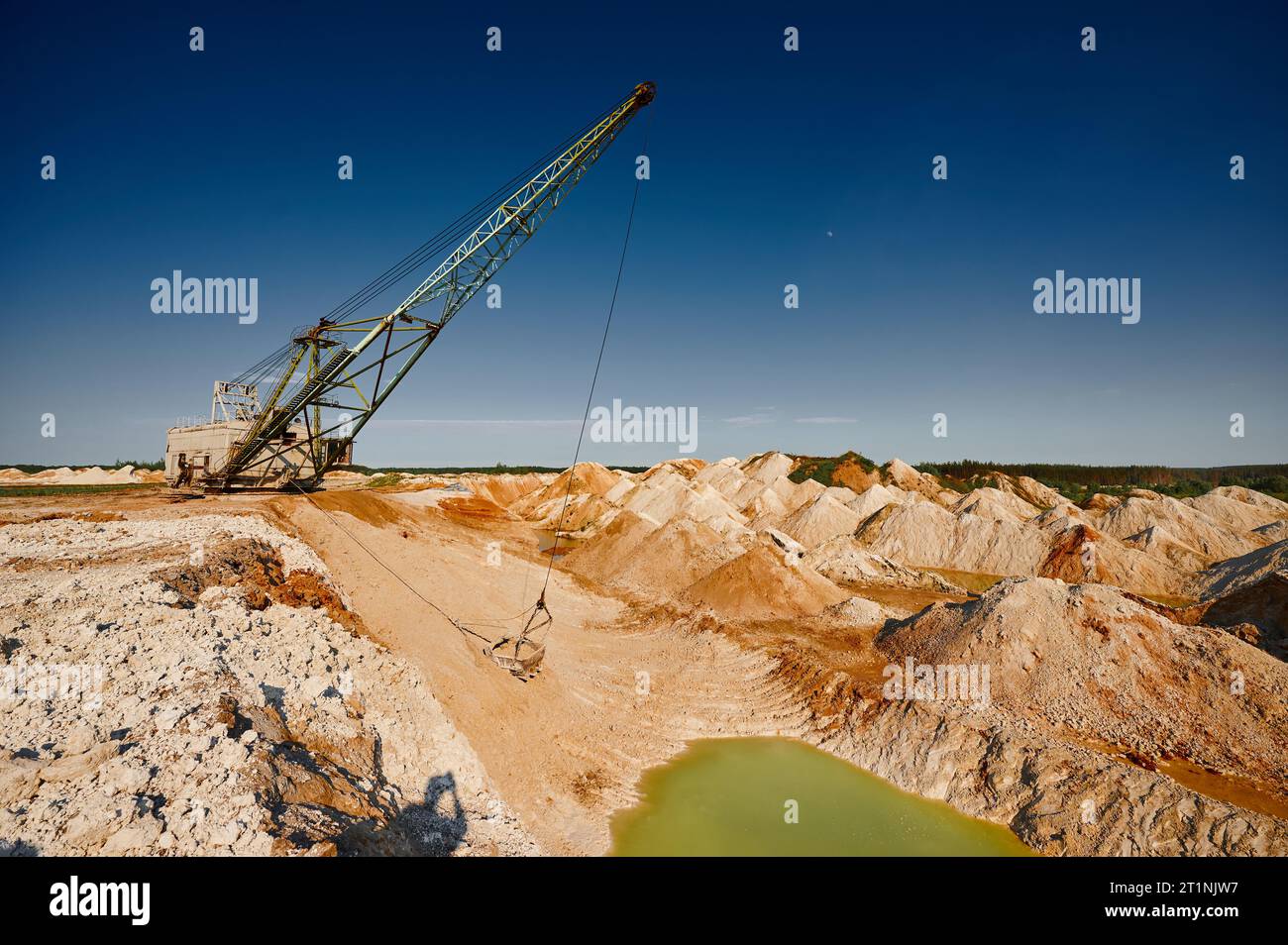 Old dragline mines minerals in chalk quarry on sunny day Stock Photo ...