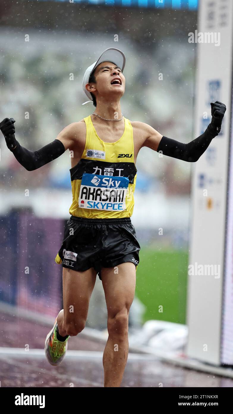 Akira Akasaki crosses a finish line during Marathon Grand Championship ...