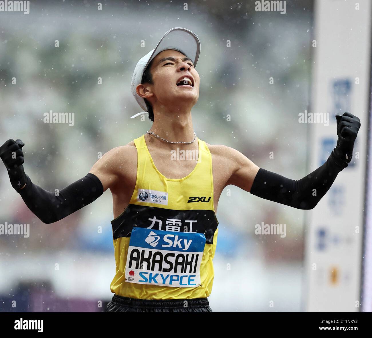 Akira Akasaki crosses a finish line during Marathon Grand Championship ...