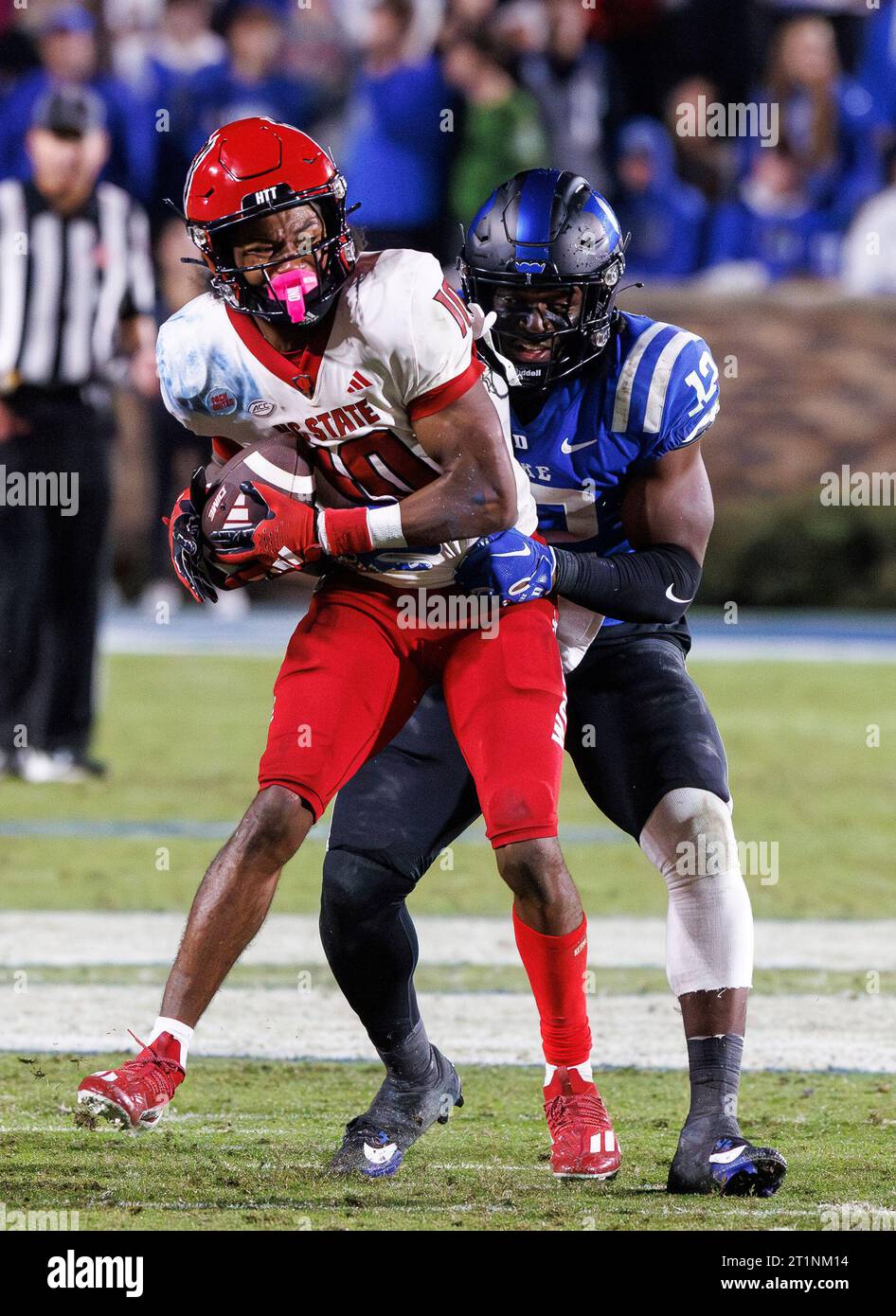 North Carolina State's Kevin Concepcion (10) is tackled by Duke's Tre ...