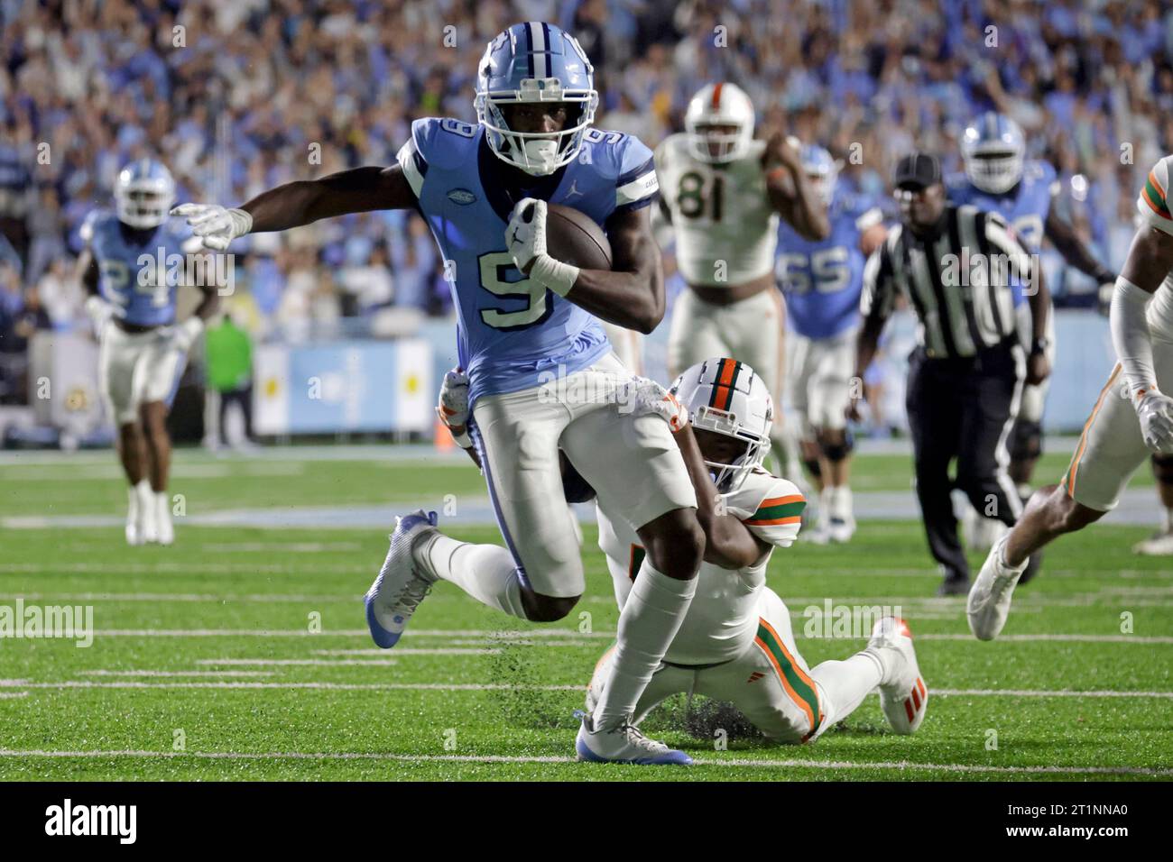 North Carolina wide receiver Devontez Walker (9) breaks a tackle ...
