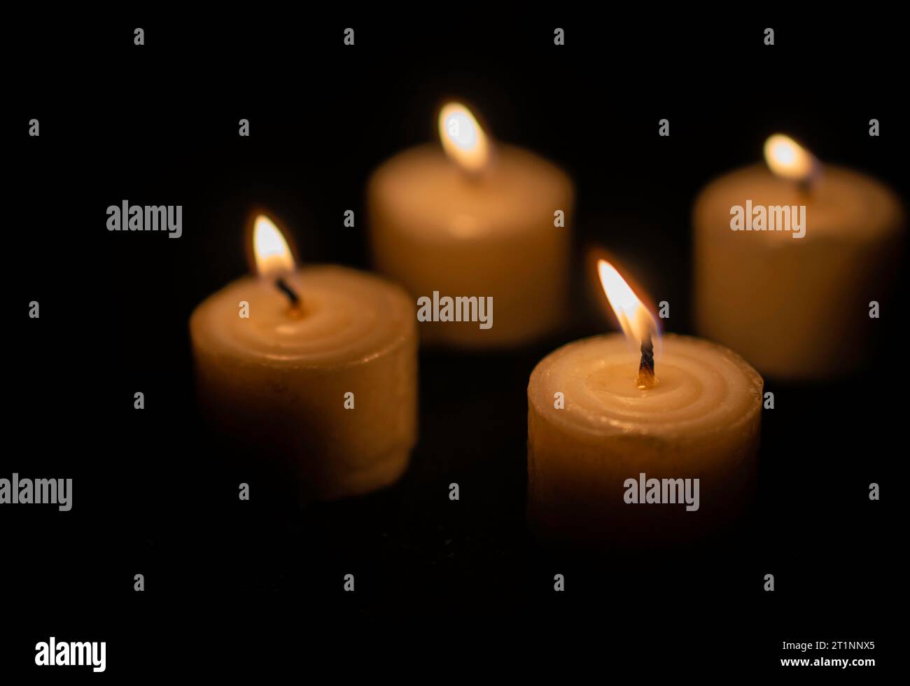 Candles light. Christmas candles burning at night. Abstract candles ...