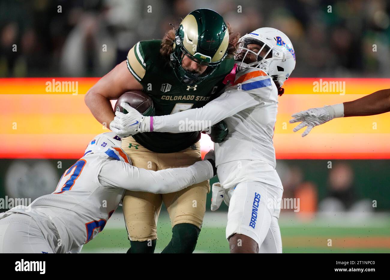 Colorado State tight end Dallin Holker, center, is tackled after ...