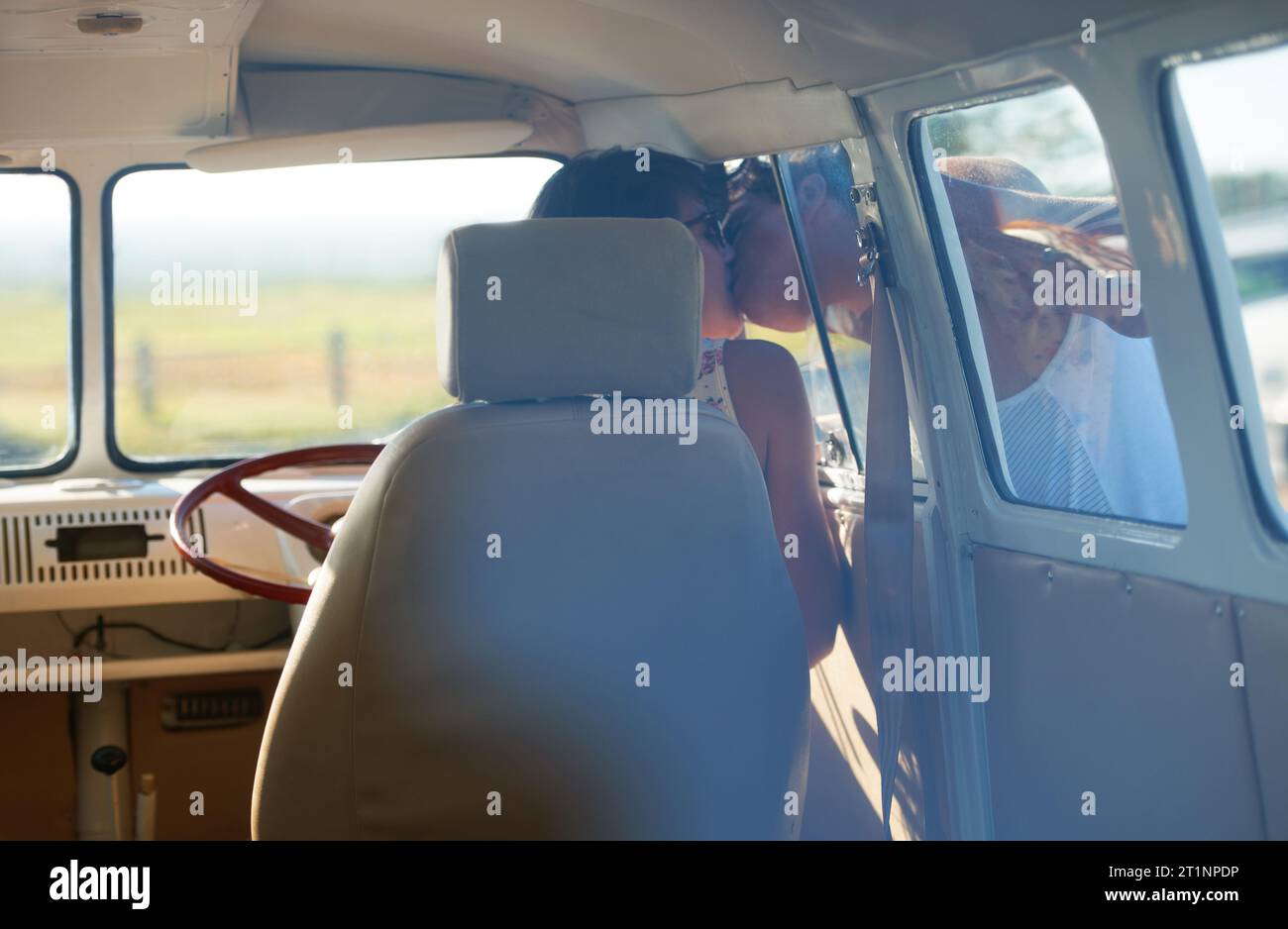 Caravan, transport and couple kiss on road trip, travel and vacation ...