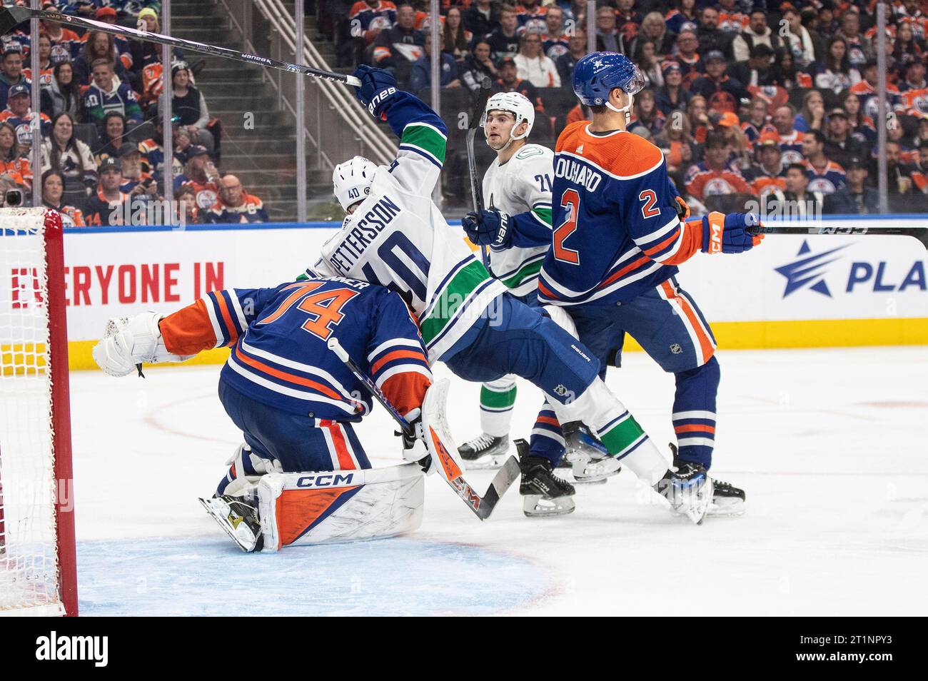 Vancouver Canucks' Elias Pettersson (40) crashes into Edmonton Oilers ...