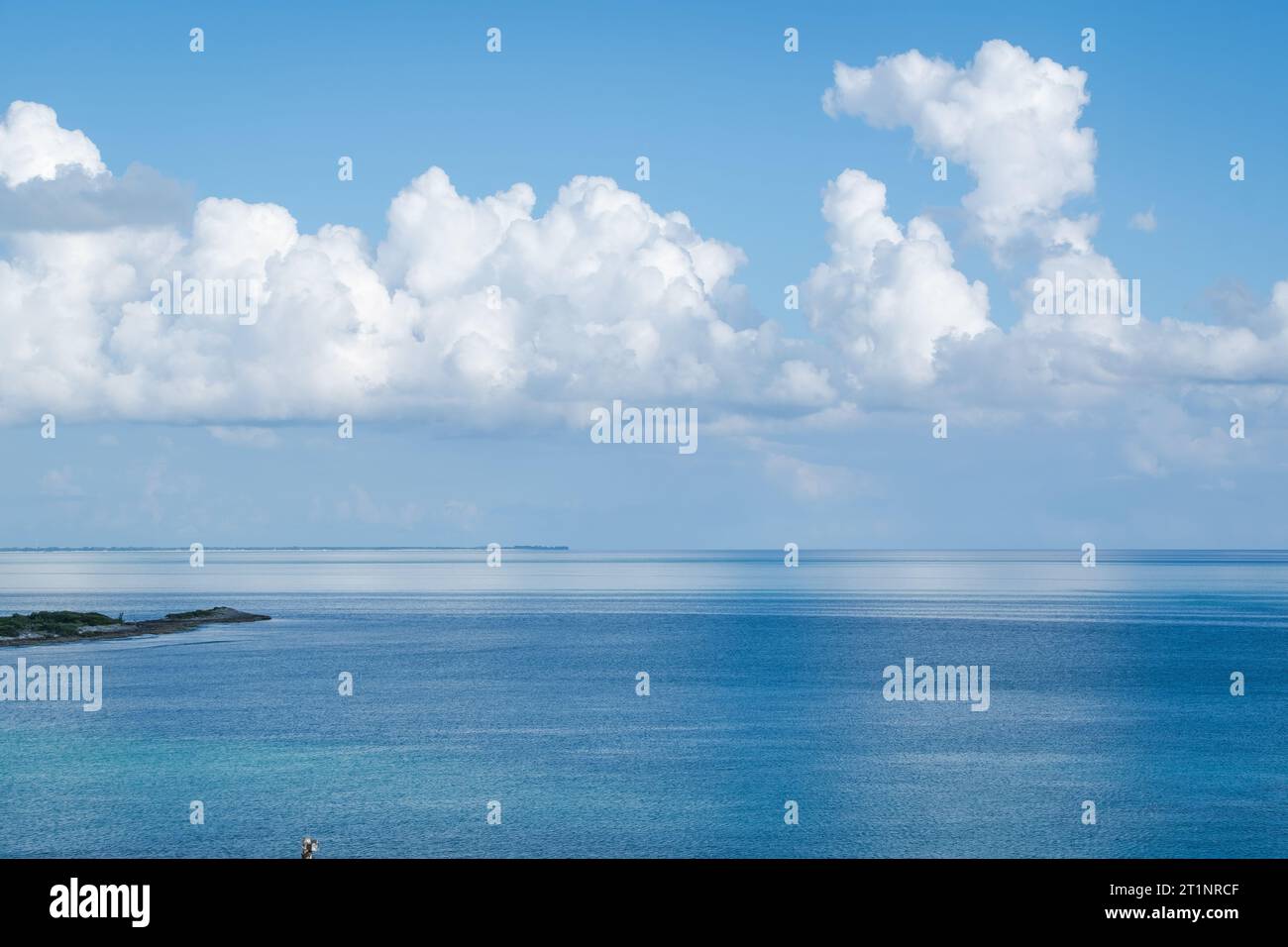 Blue sky with white fluffy clouds reflection on the water in the ...