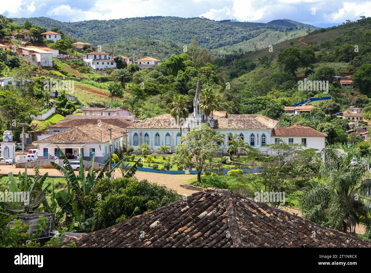 View in a valley with colonial buildings and mountains covered with ...
