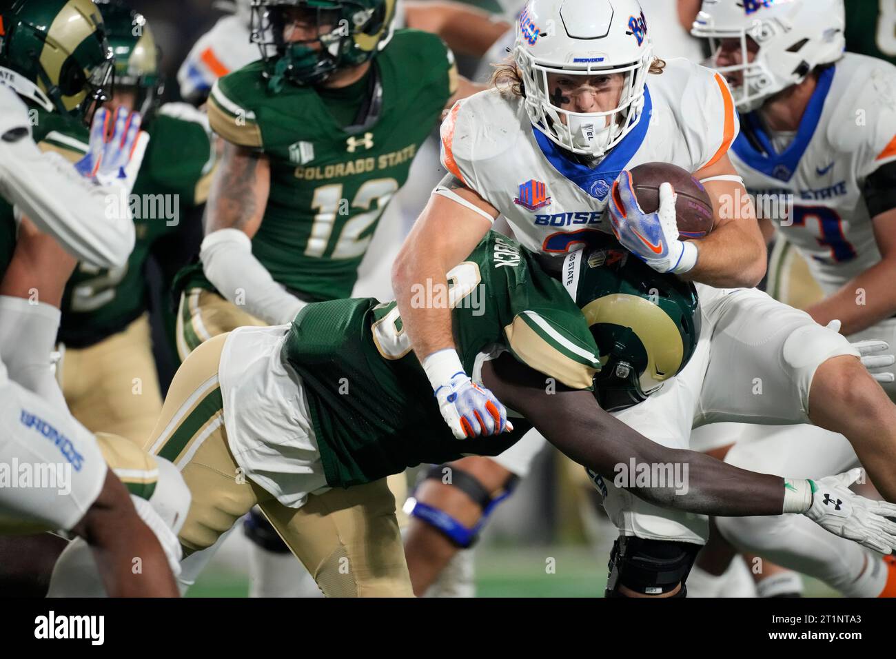 Colorado State linebacker Buom Jock, left, tackles Boise State running ...