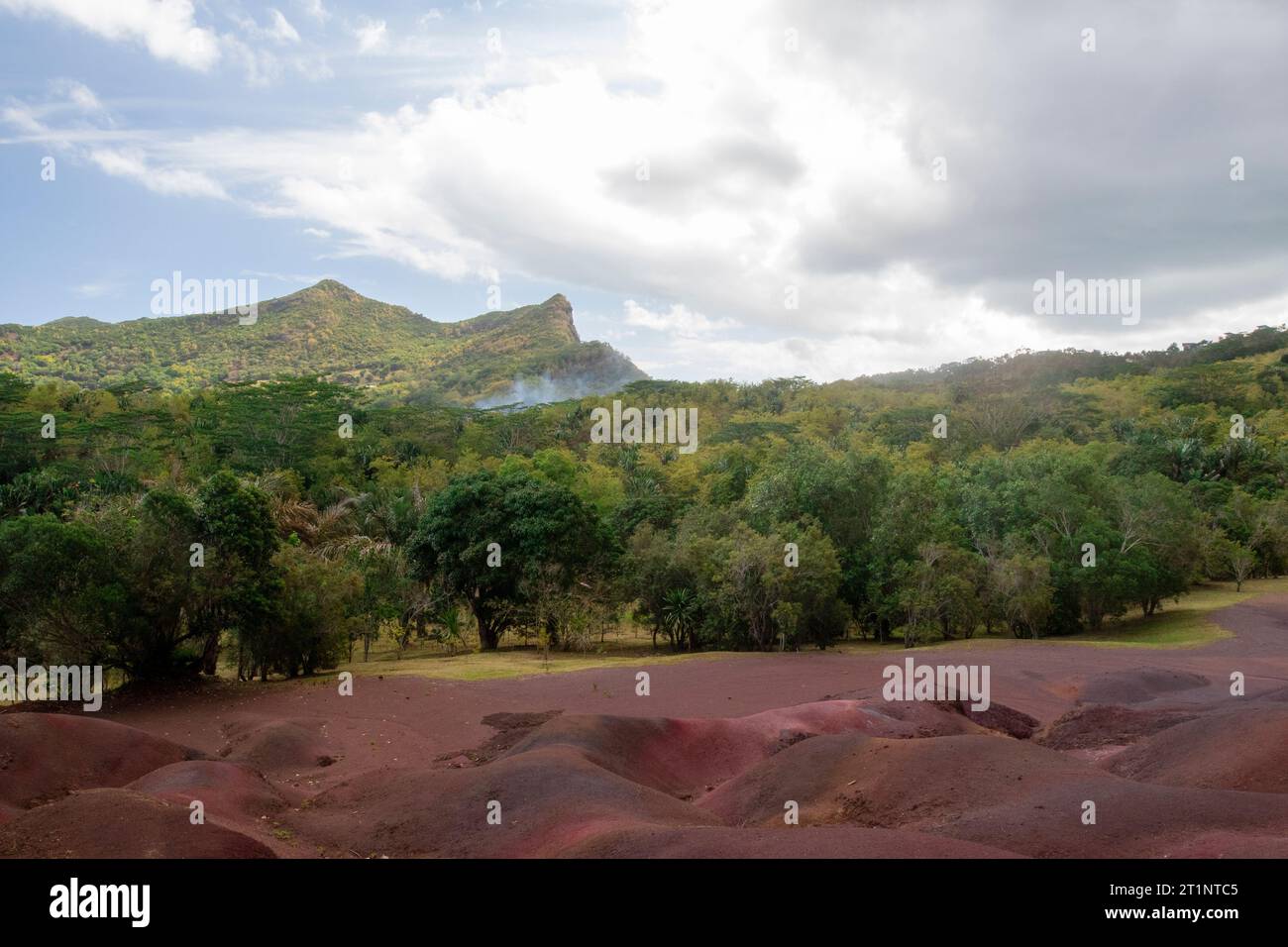 Seven color volcanic earth under cloudy sky Stock Photo - Alamy