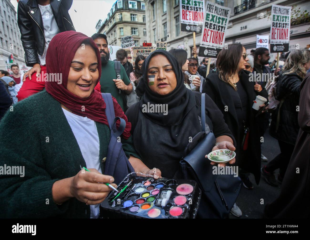 London, UK. 14th Oct, 2023. A protester armed with a paint palette ...