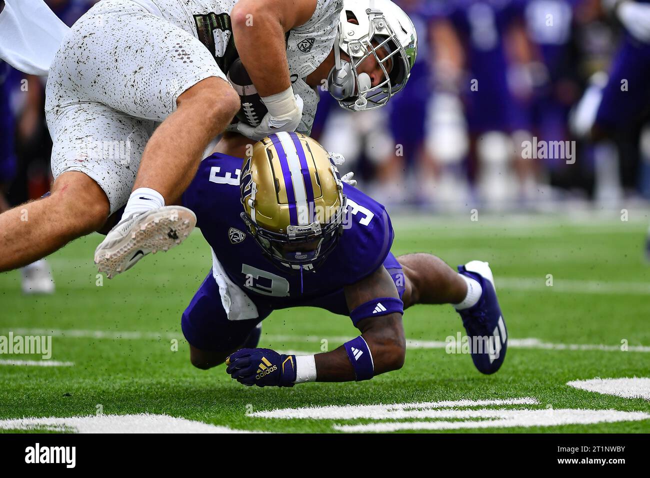 Seattle, WA, USA. 14th Oct, 2023. Washington Huskies safety Mishael Powell (3) brings down ...
