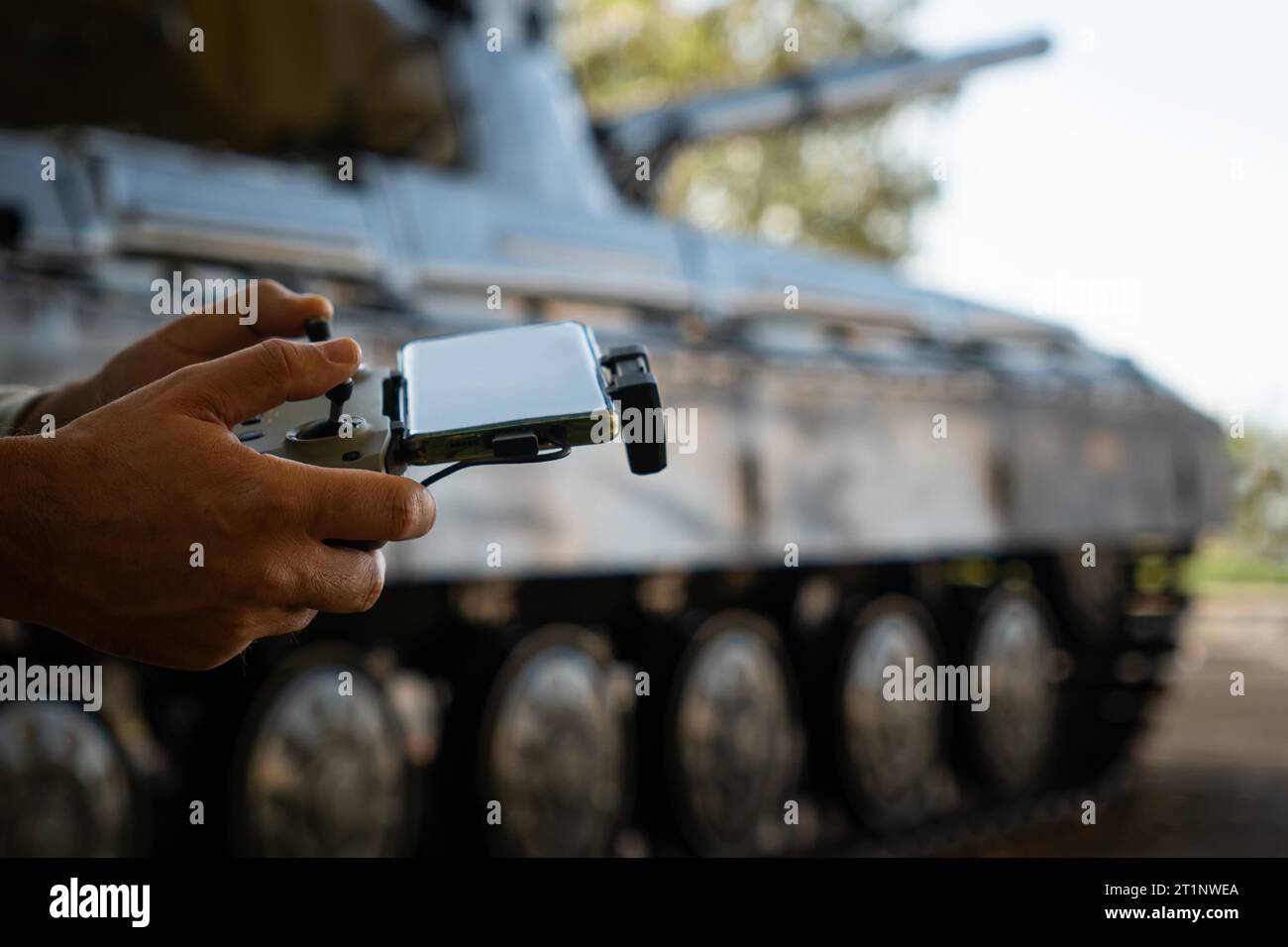 a man with a UAV control panel in his hands, a drone flying above the ...