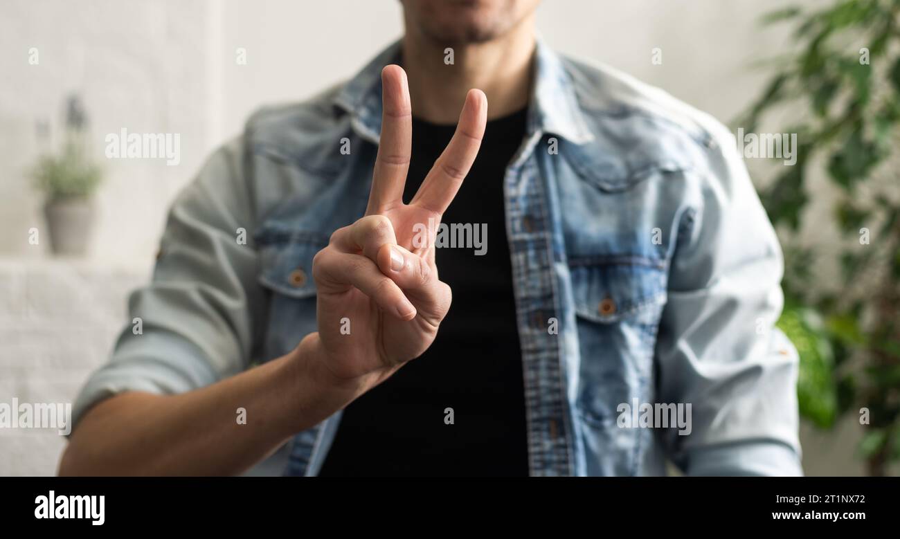 Adult Learning Sign Language For Deaf Disabled Stock Photo - Alamy