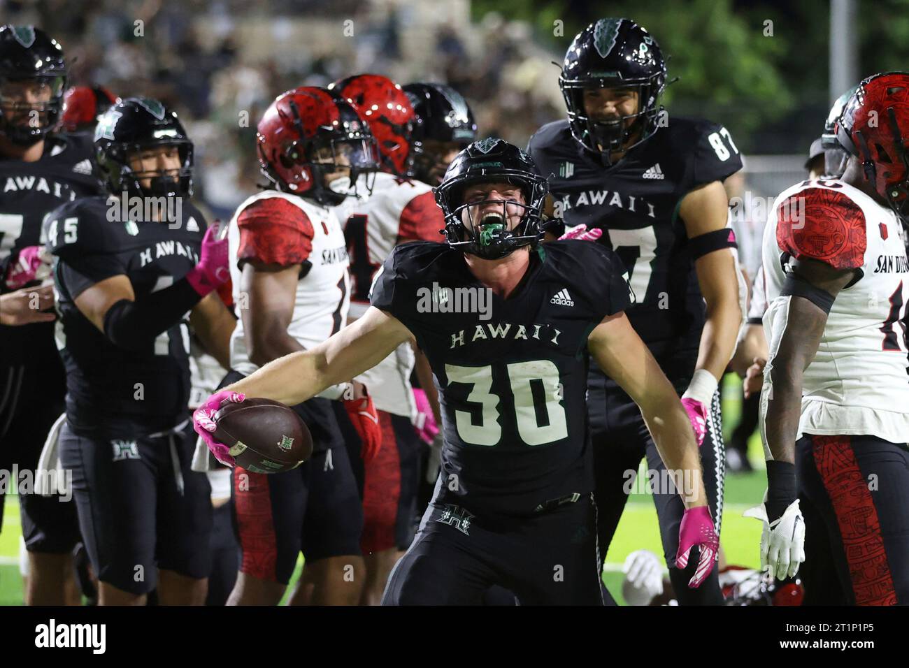 Hawaii running back Landon Sims (30) reacts after making a touchdown ...