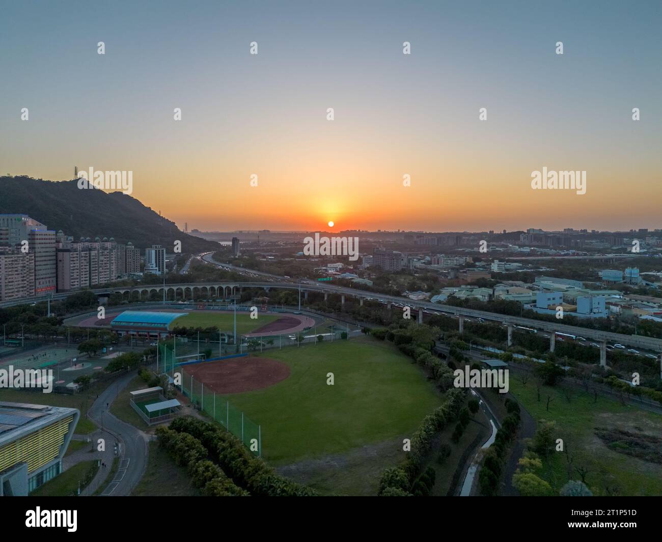 Aerial view of Sanxia District with cars on highway during sunset in New Taipei City, Taiwan ...