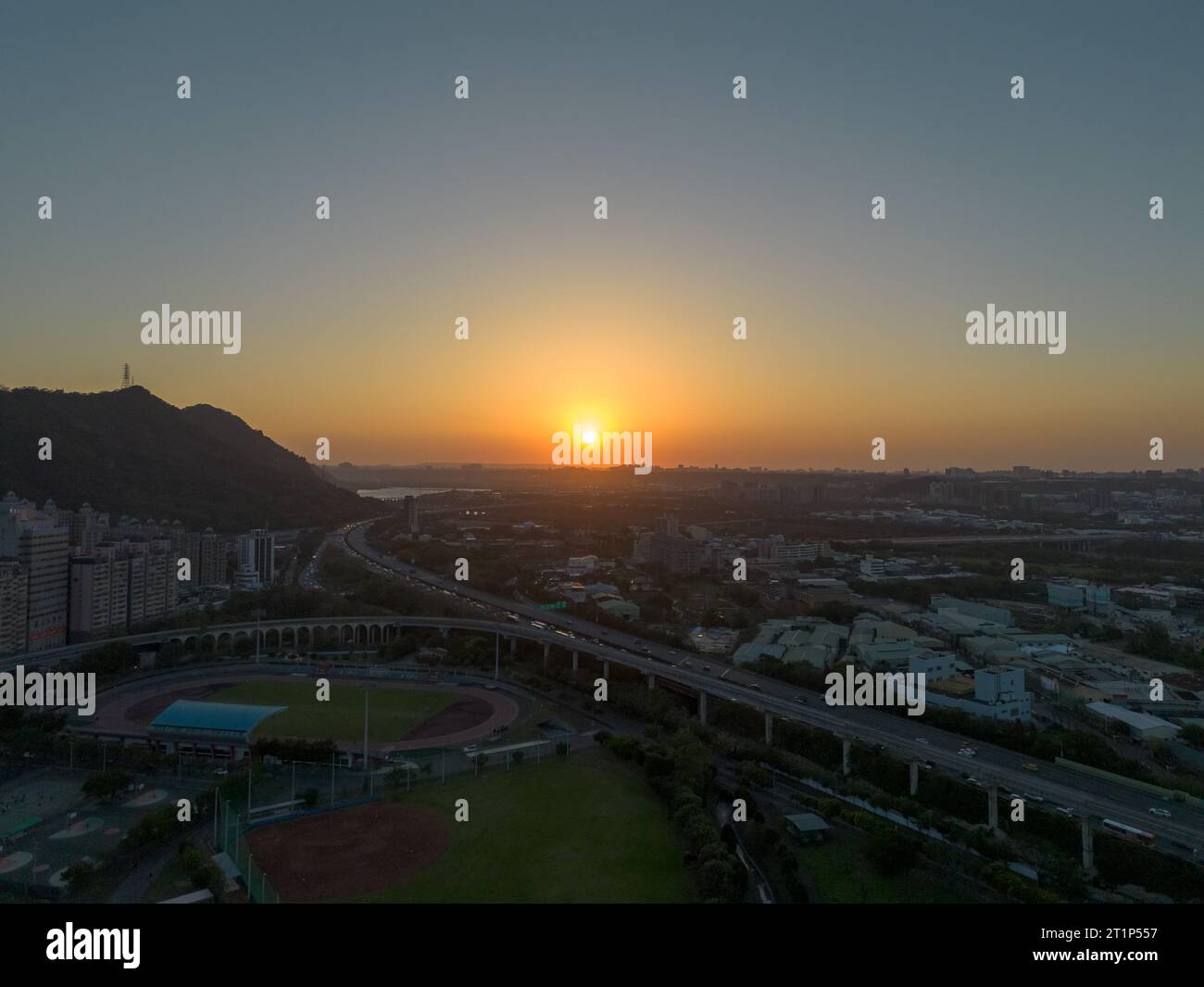 Aerial view of Sanxia District with cars on highway during sunset in New Taipei City, Taiwan ...