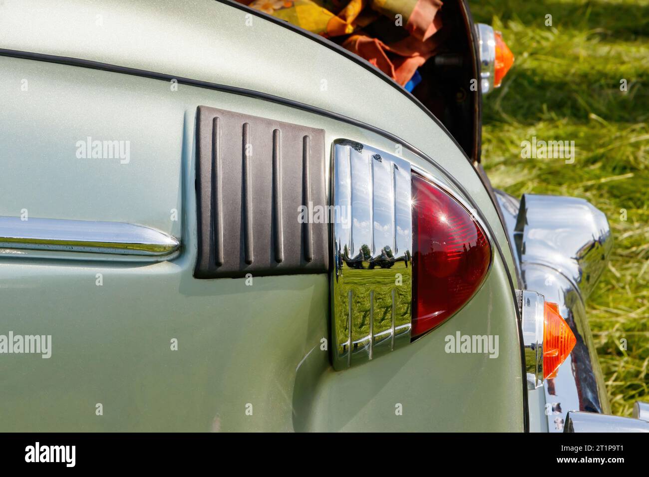 close up of rear wing light fender of green vintage 1950s Vauxhall ...