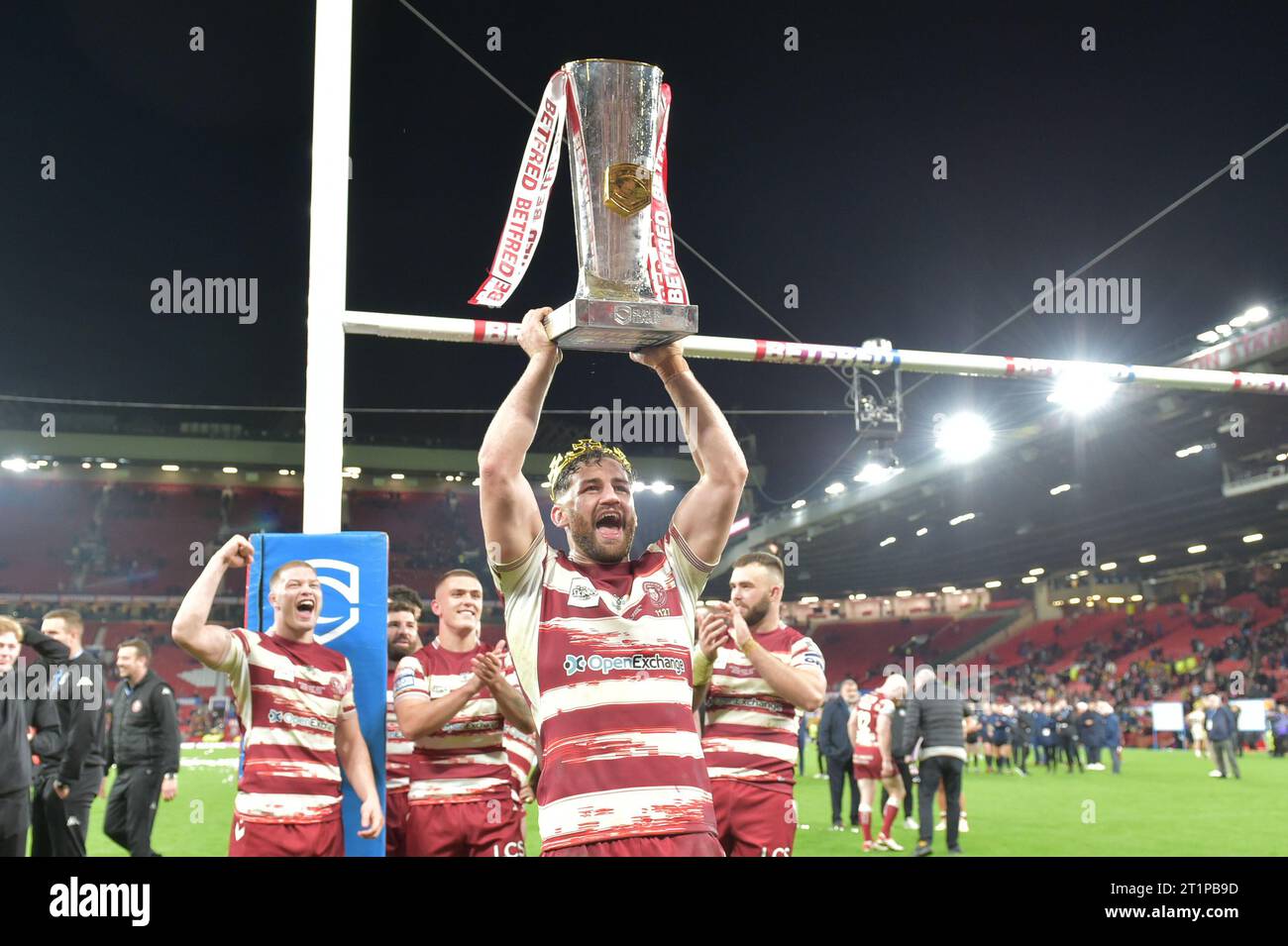 Toby King #3 of Wigan Warriors lifts the trophy infront of the fans ...