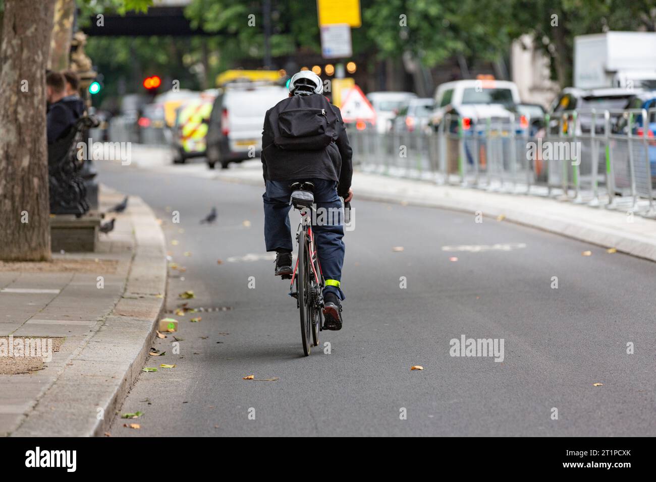 cyclist on protected cycle route in London Stock Photo - Alamy